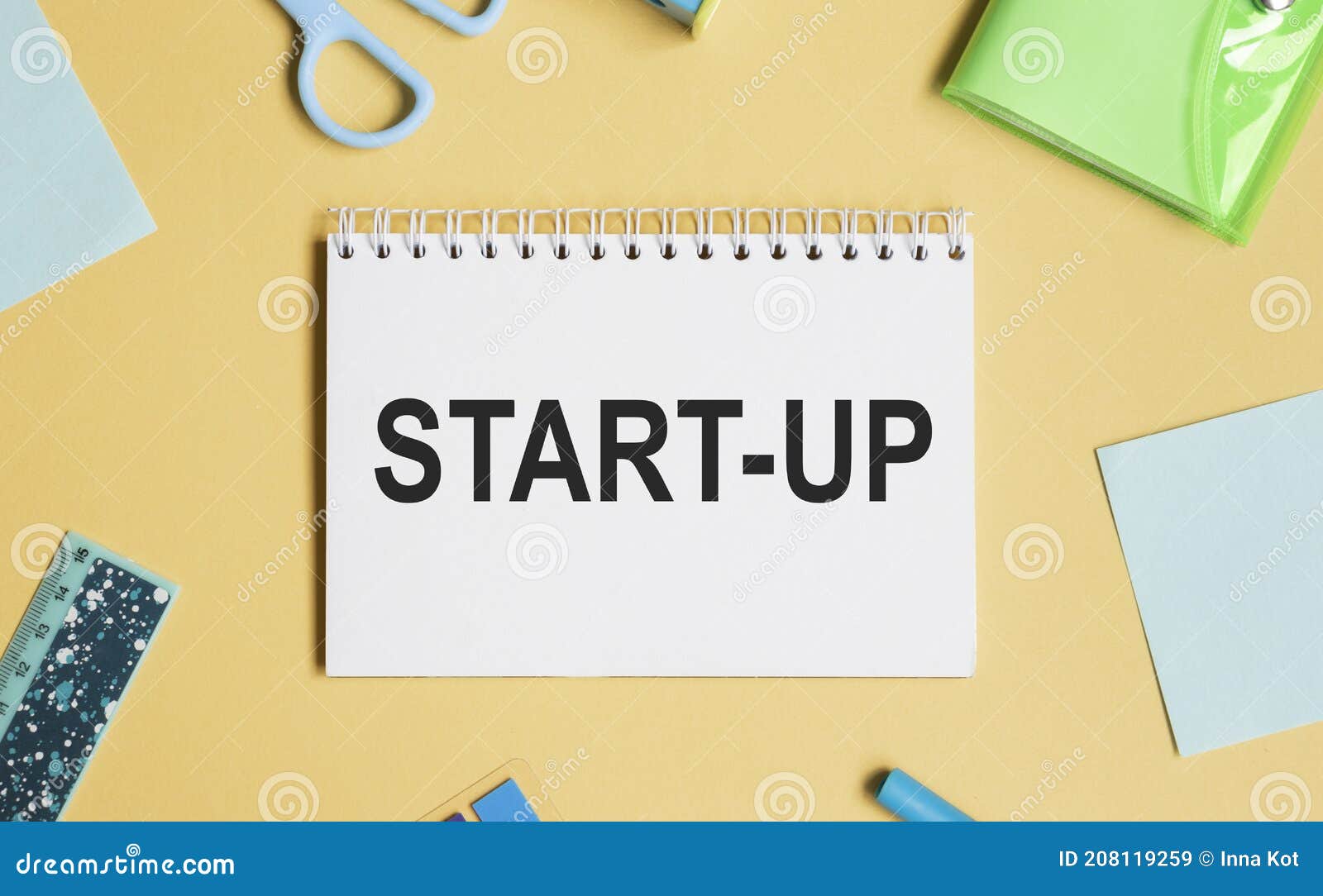 Notebook with Text Inside Start Up on Table with Stock Image - Image of ...