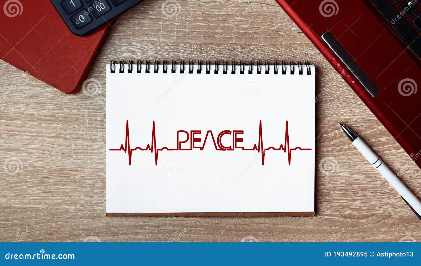Notebook With Text PEACE In The Form Of An ECG. Notebook On Desk With ...