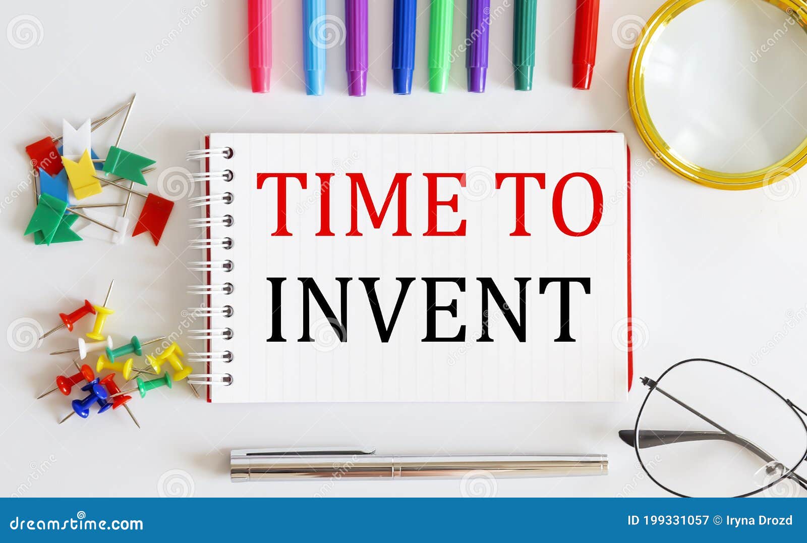 Notebook with TIME TO INVENT Word with Office Tools on White Table ...