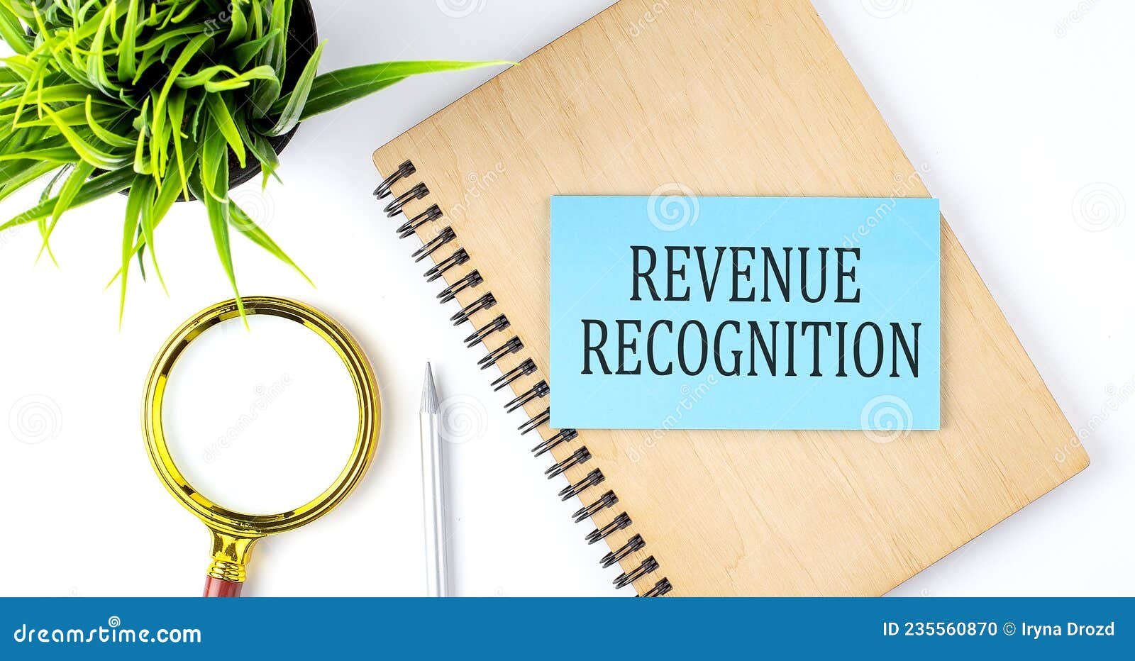 Notebook with Tools and Notes with Text on the Blue Sticker REVENUE ...