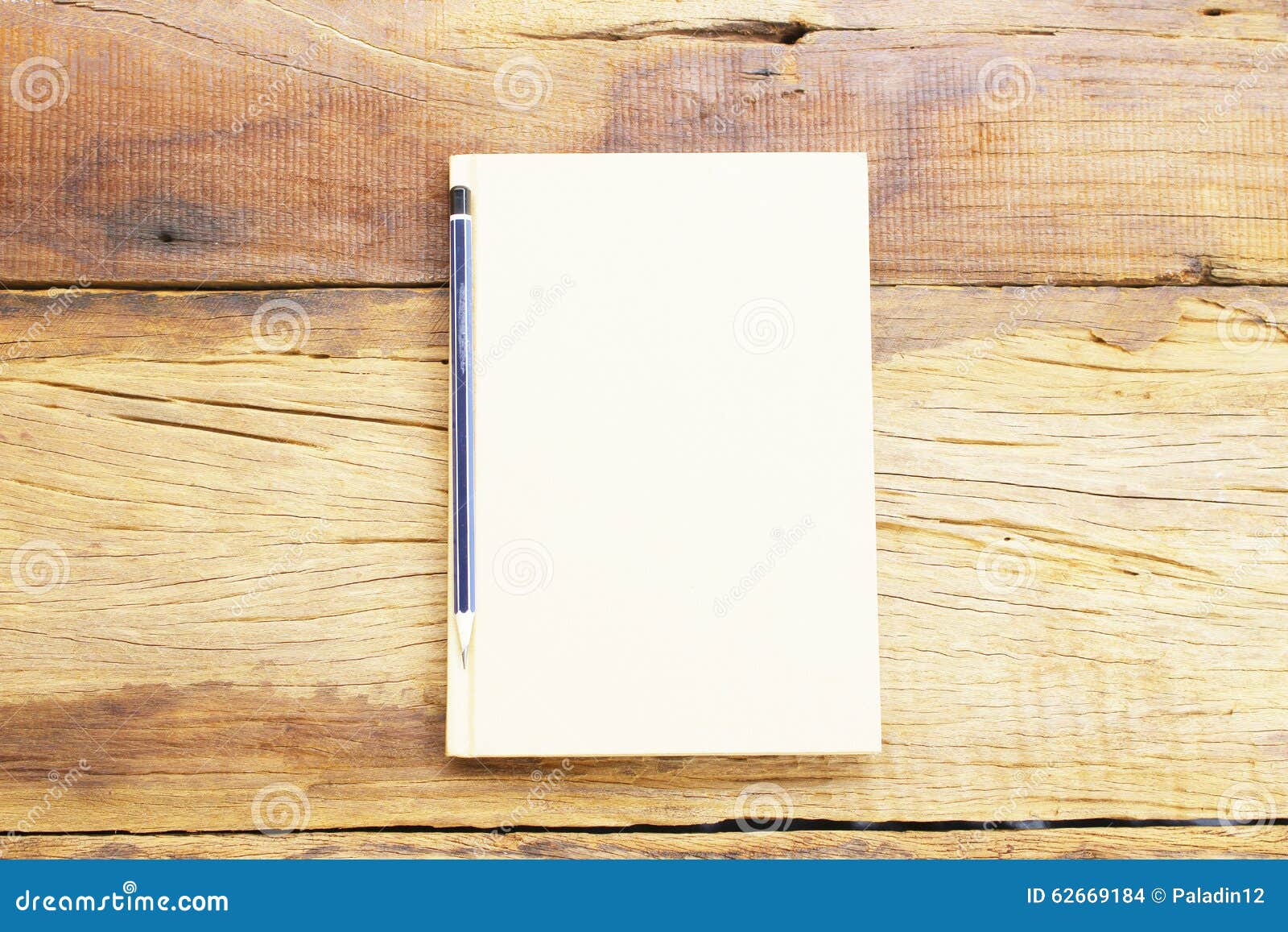 Notebook on wooden table stock photo. Image of cover - 62669184