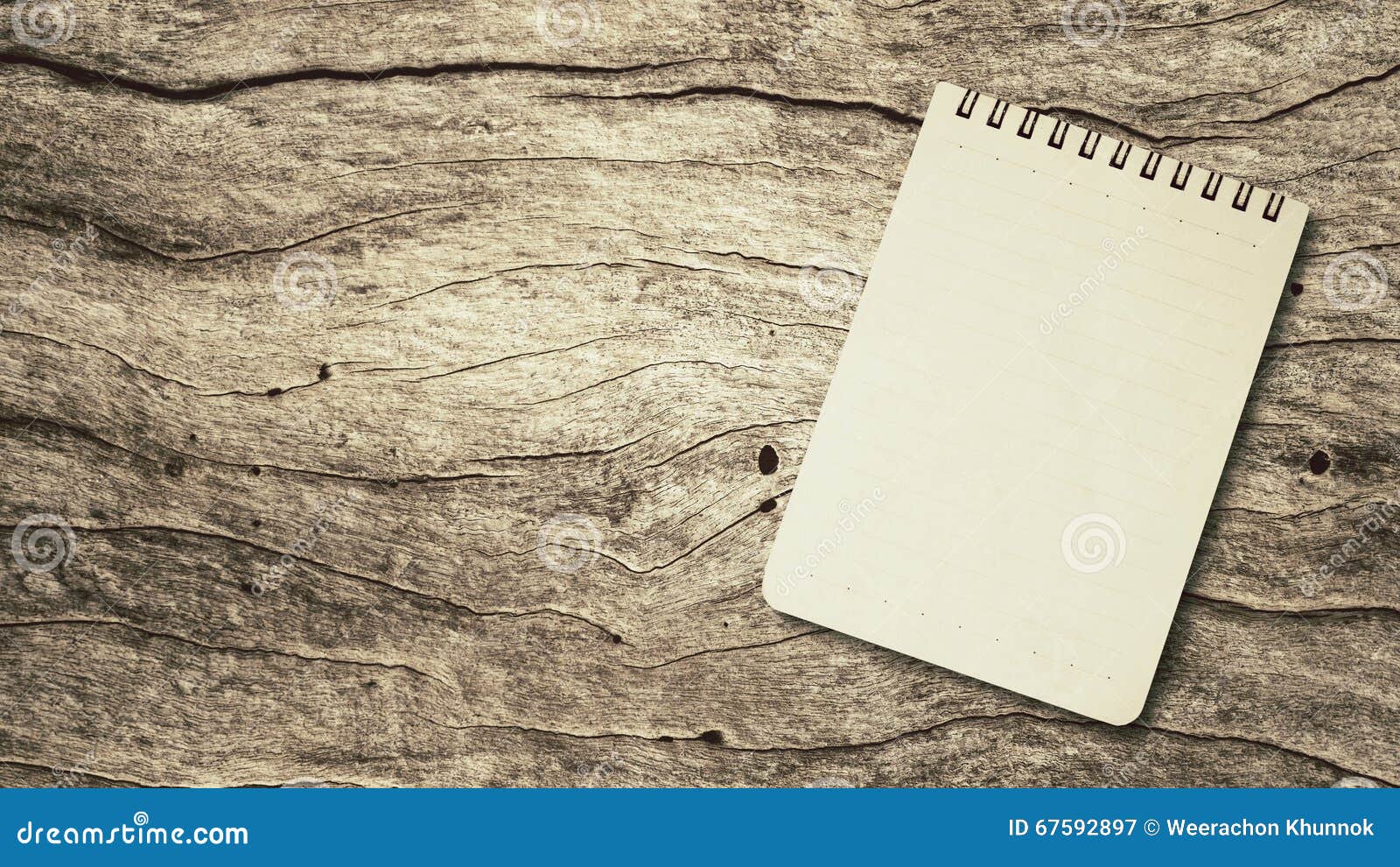 Notebook on a wooden table stock image. Image of notepad - 67592897