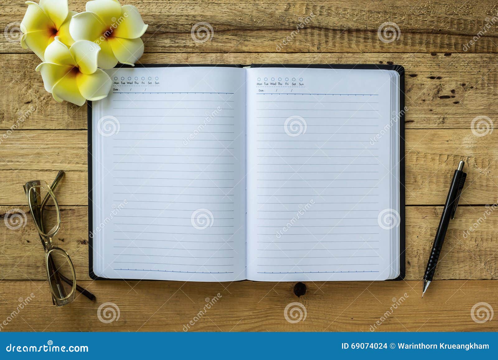 Notebook on wooden table stock photo. Image of flower - 69074024