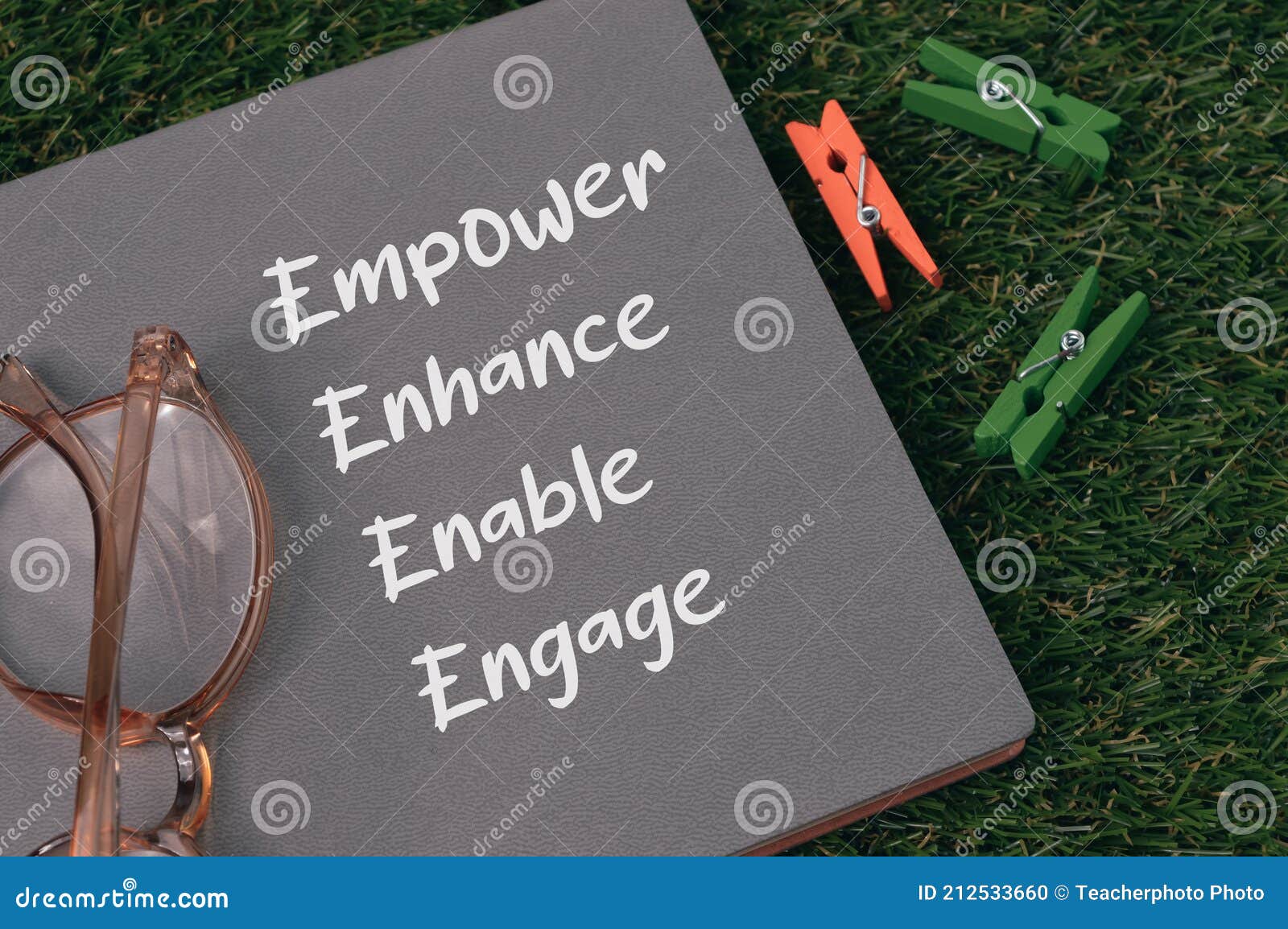Notebook Written with EMPOWER, ENHANCE, ENABLE and ENGAGE Stock Photo ...