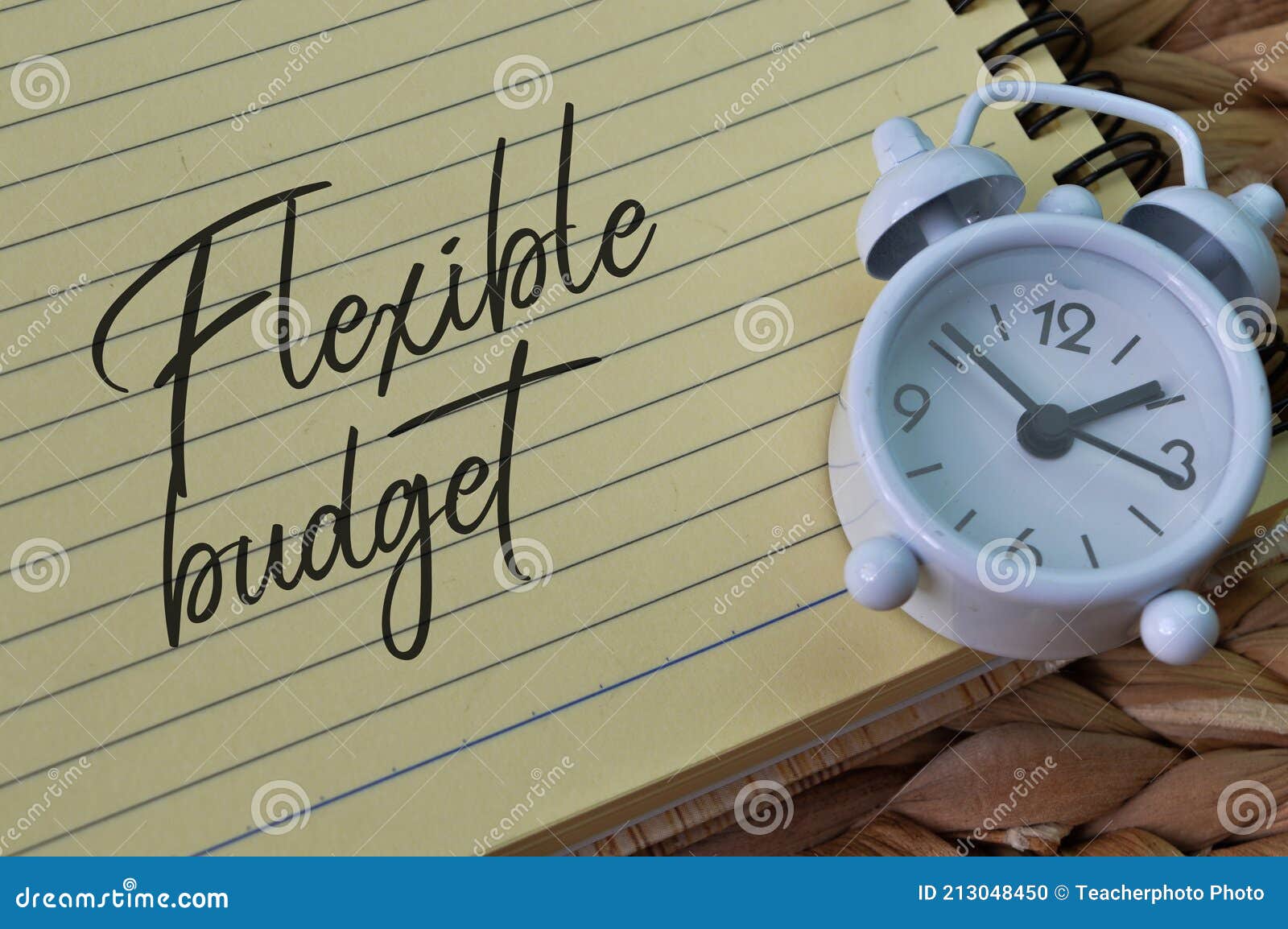 Clock and Notebook Written with Text FLEXIBLE BUDGET Stock Photo ...