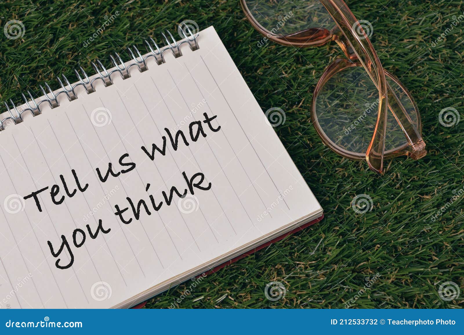 Notebook Written with TELL US WHAT YOU THINK Stock Photo - Image of ...