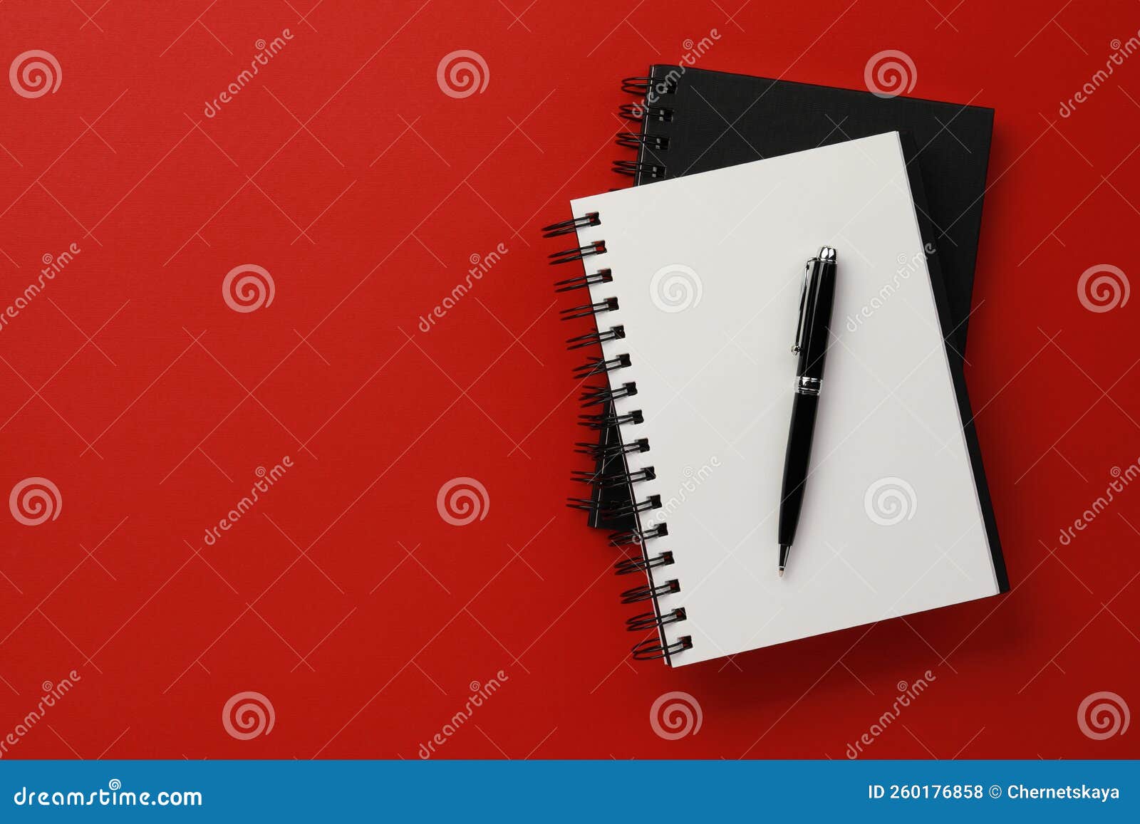 Notebooks and Pen on Red Background, Top View. Space for Text Stock ...