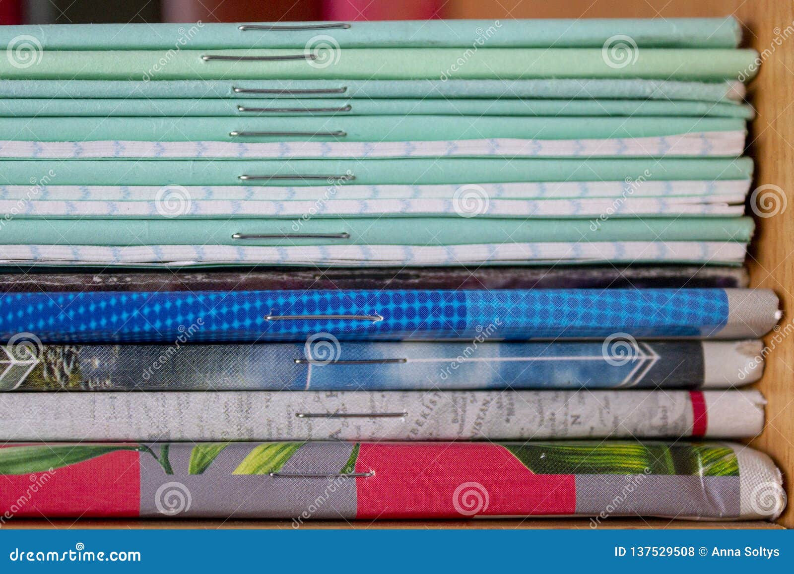 Notebooks are Stacked on the Shelf of the Cabinet Stock Photo - Image ...