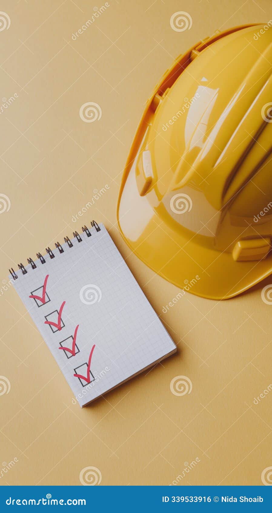 Notepad with Checkmarks beside Construction Hard Hat, Yellow Background ...