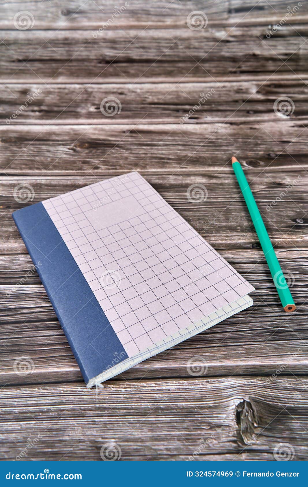 Notepad with Crossed and Parallel Lines Along with a Pencil on a Wooden ...