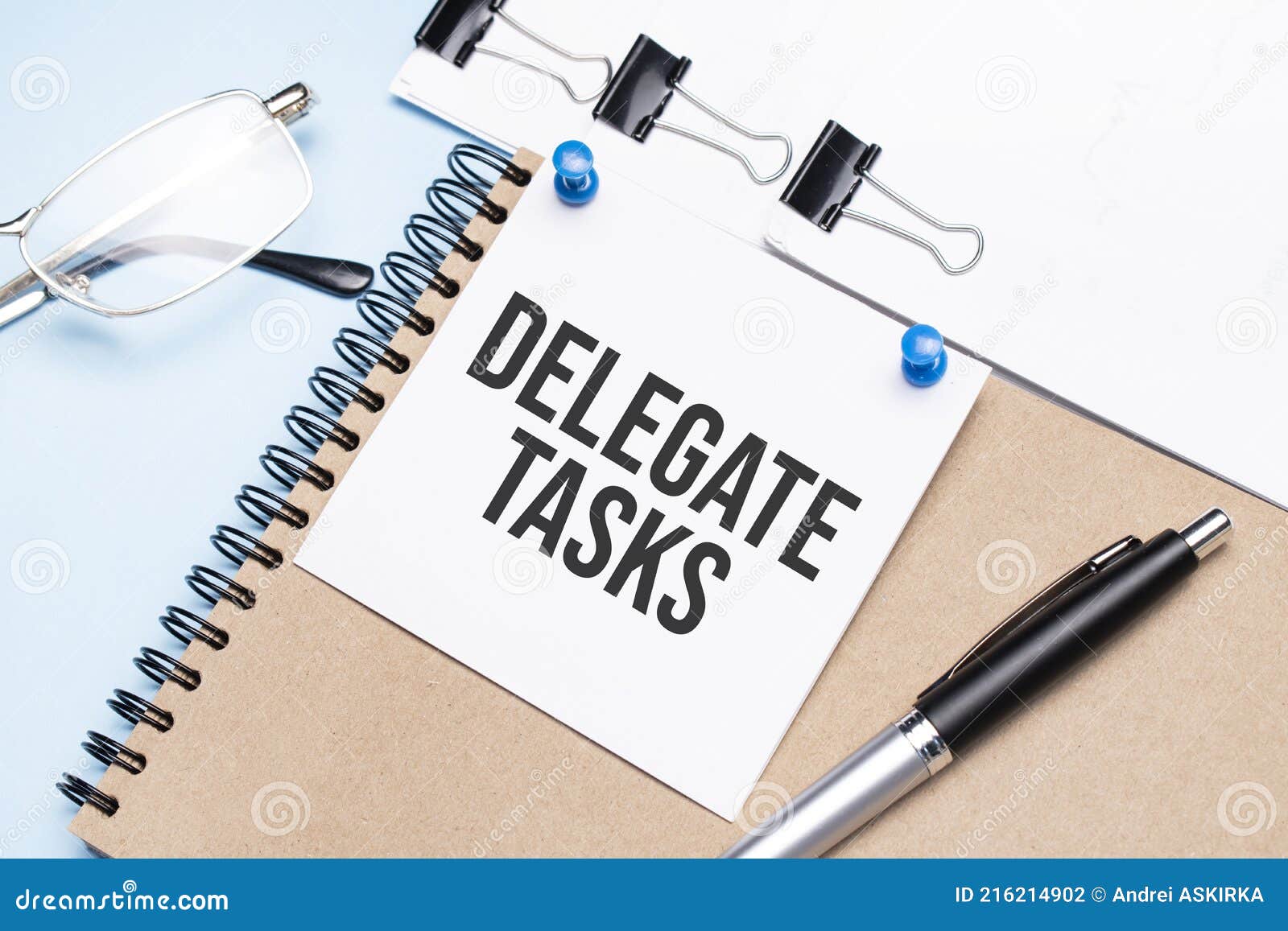 Notepad with Delegate Tasks Text on the Office Table with Glasses ...