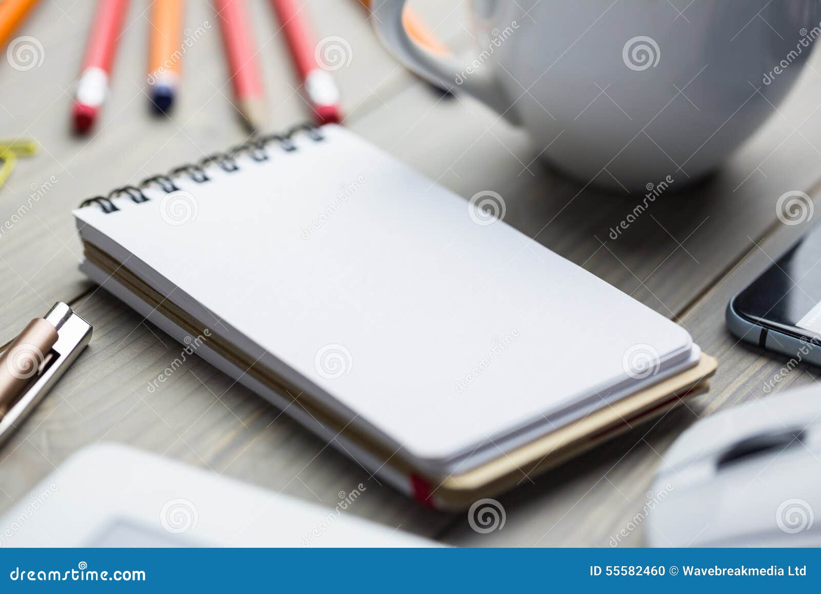 Notepad on the Desk Next To Cup Tablet and Smartphone Stock Photo ...