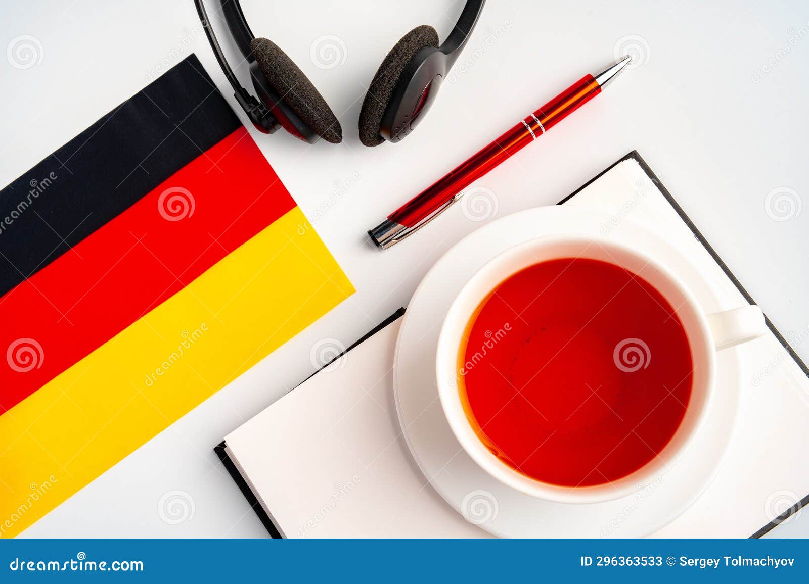 Notepad with German Flag and Headphones on White Background. German ...