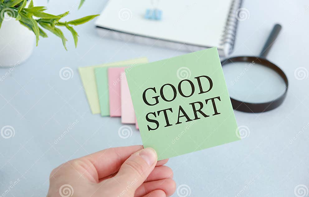 Notepad with Good Start Text in Hand on Office Desk Stock Photo - Image ...