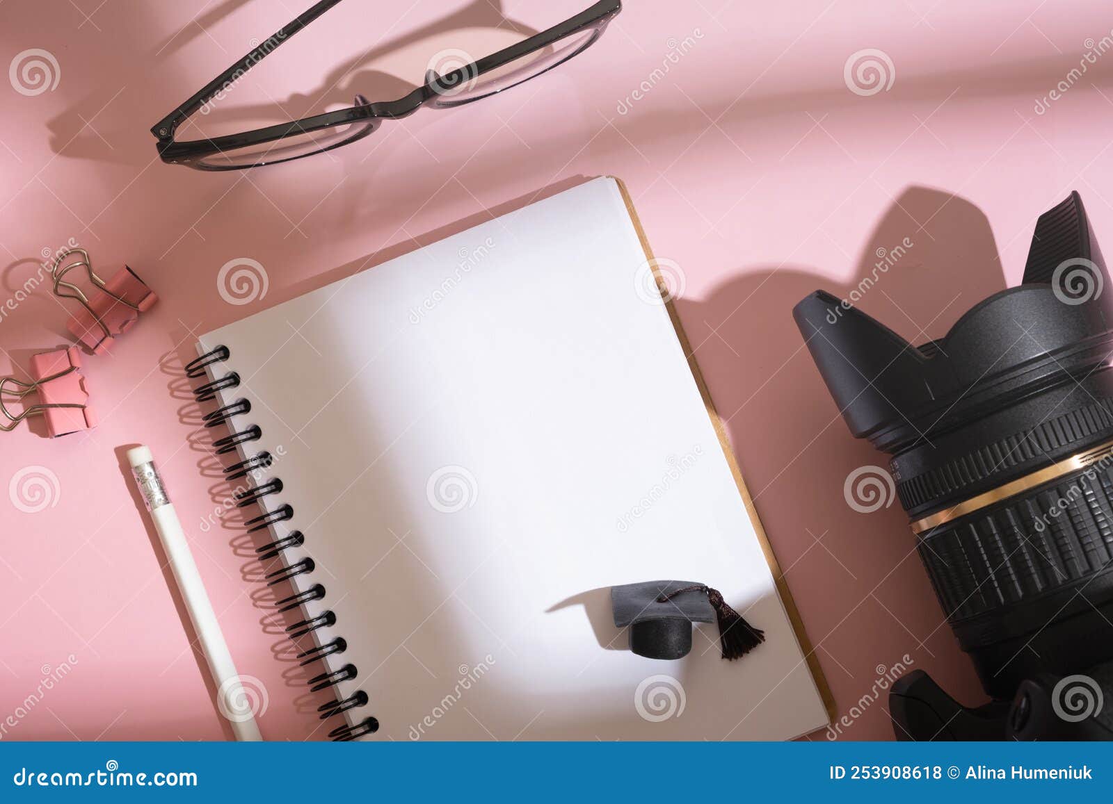 Notepad, Graduate Cap and Camera on Desktop Top View. Learning ...