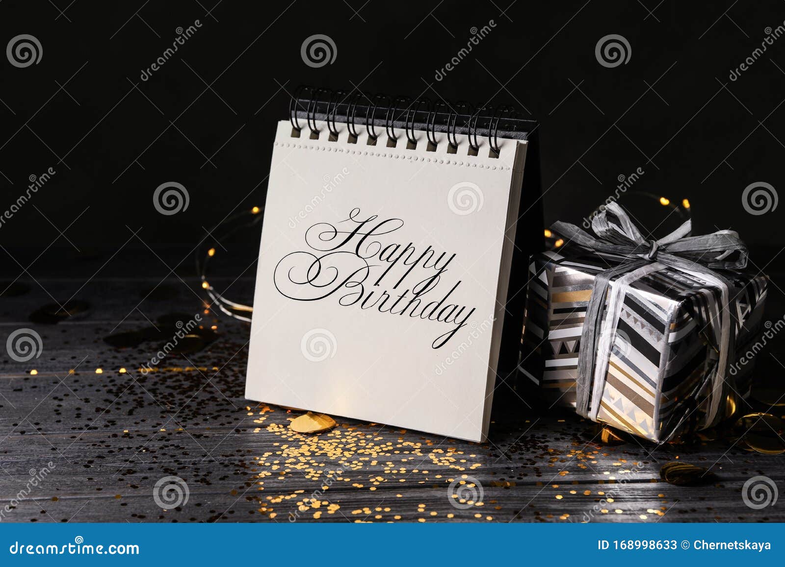 Notepad with Greeting HAPPY BIRTHDAY and Gift on Table Stock Image ...