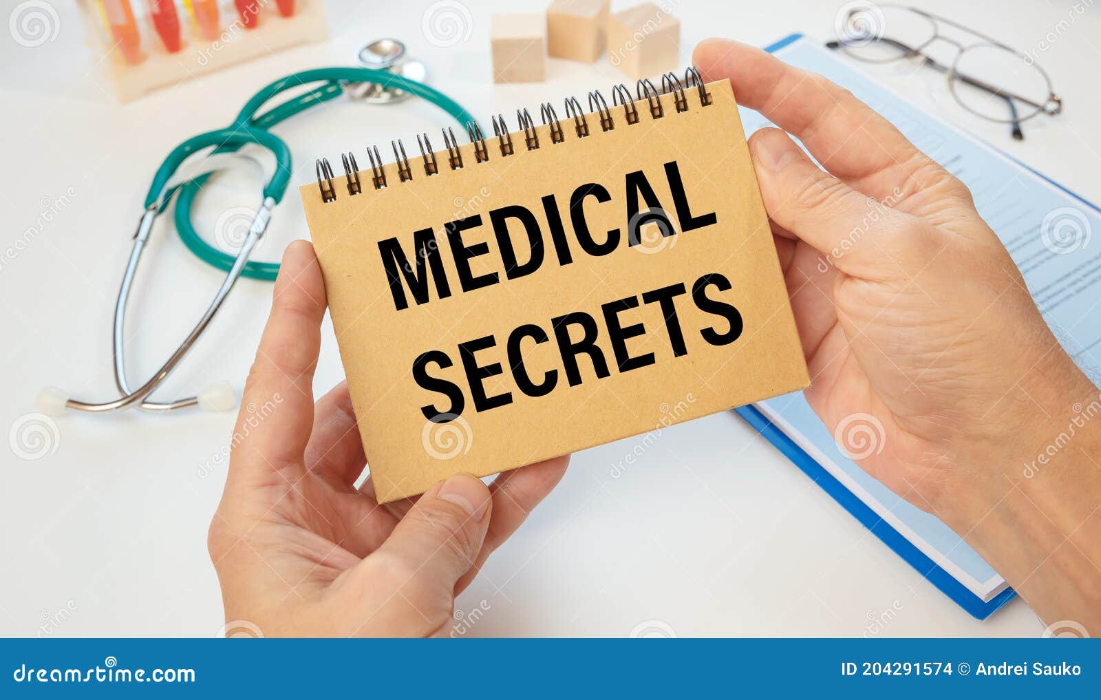 Notepad with the Inscription MEDICAL SECRETS and Stethoscope Stock ...