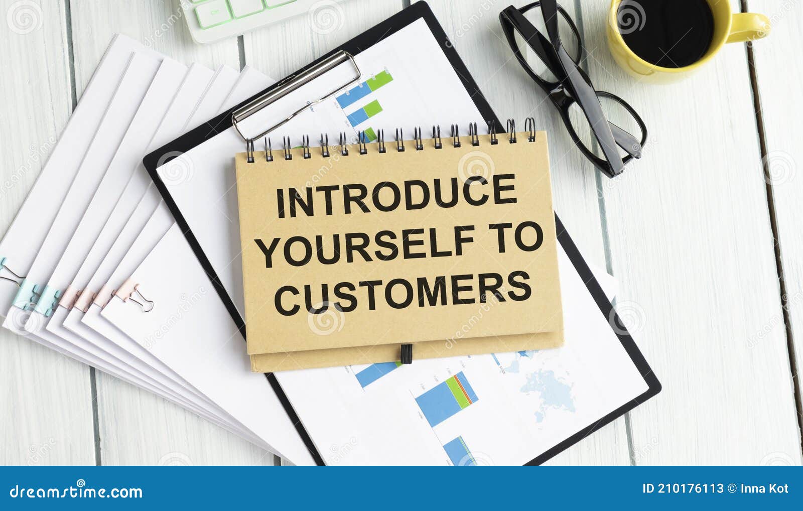 INTRODUCE YOURSELF TO CUSTOMERS Text on the Office Table with Glasses ...