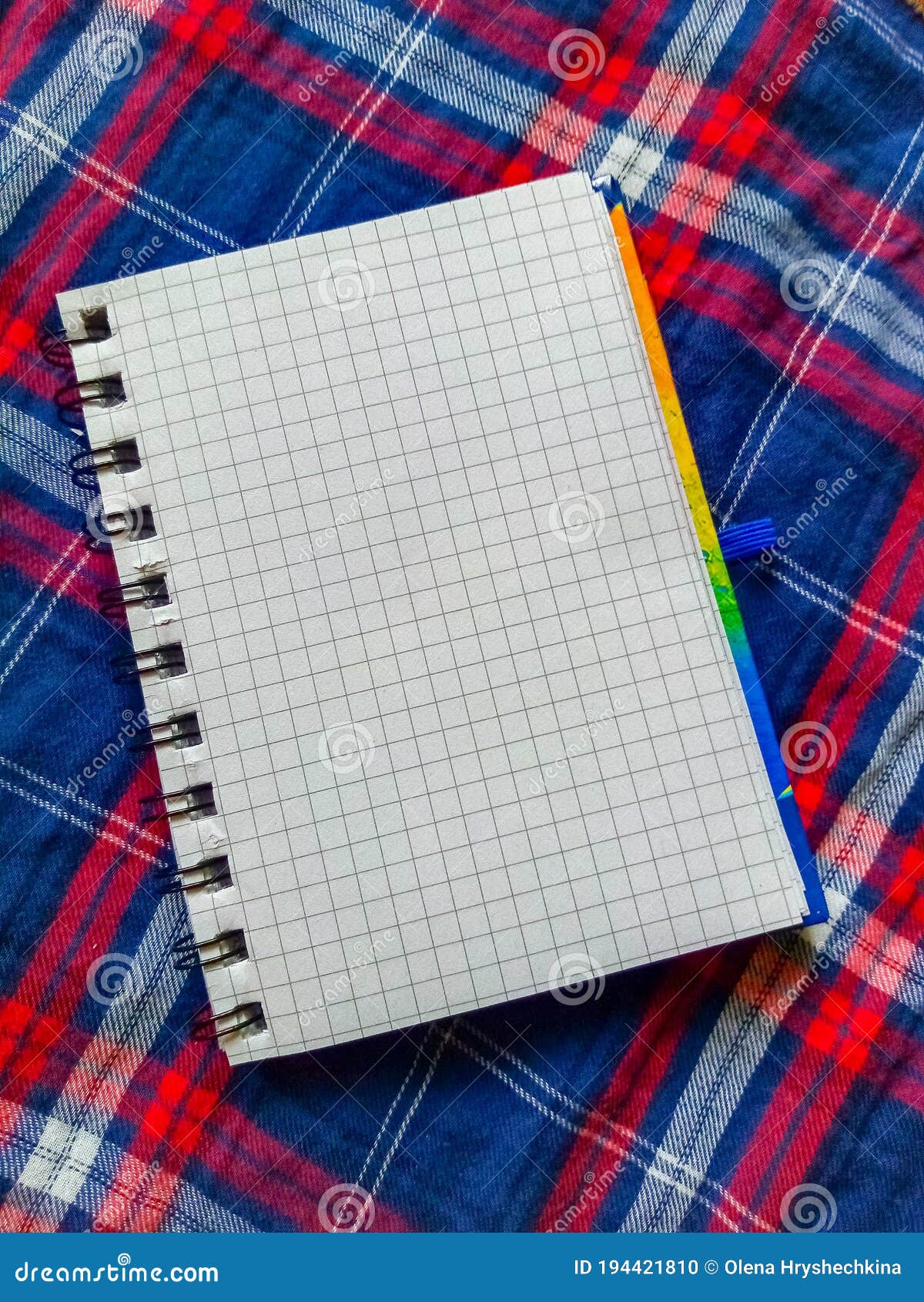Notepad Lies on a Checkered Background. Stock Photo - Image of flag ...