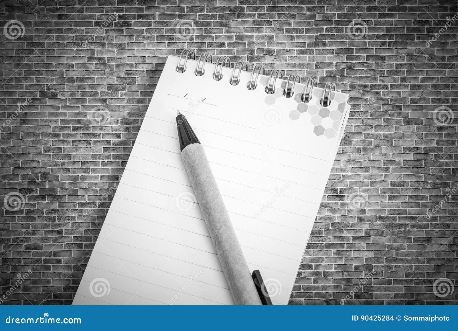 Notepad and Pen on Brick Wall Stock Photo - Image of notepad, book ...