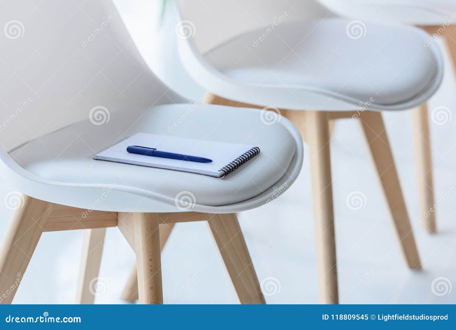 Notepad and Pen on Chair in Modern Office Stock Image - Image of ...