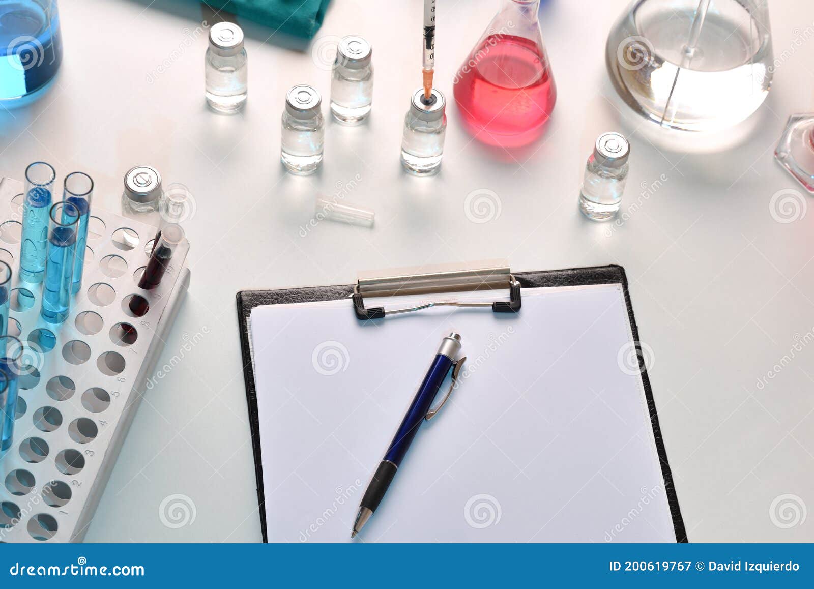 Notepad and Pen on a Lab Table Full of Vials and Supplies Stock Image ...