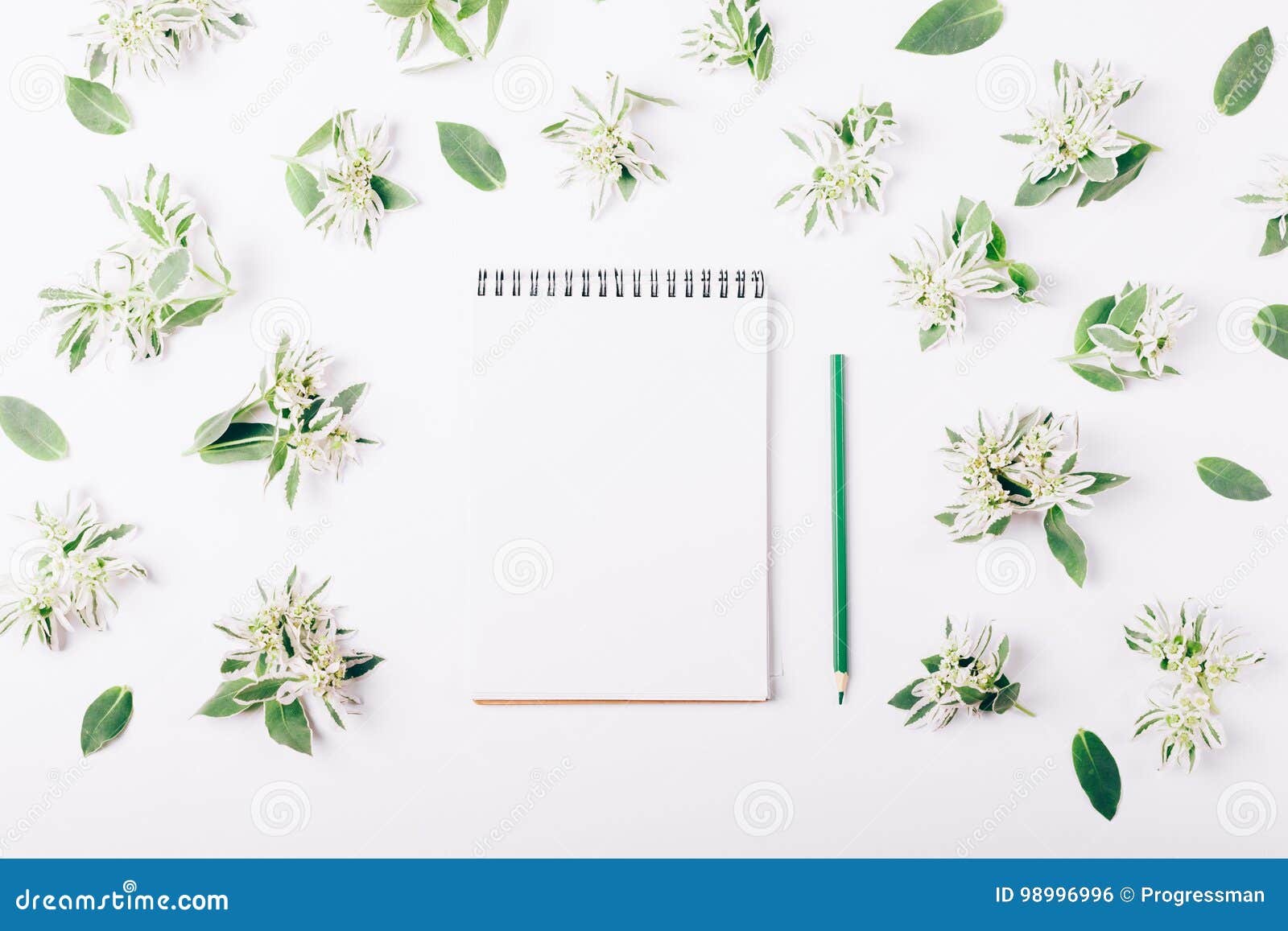 Notepad and Pencil among the Green Flowers Stock Photo - Image of ...