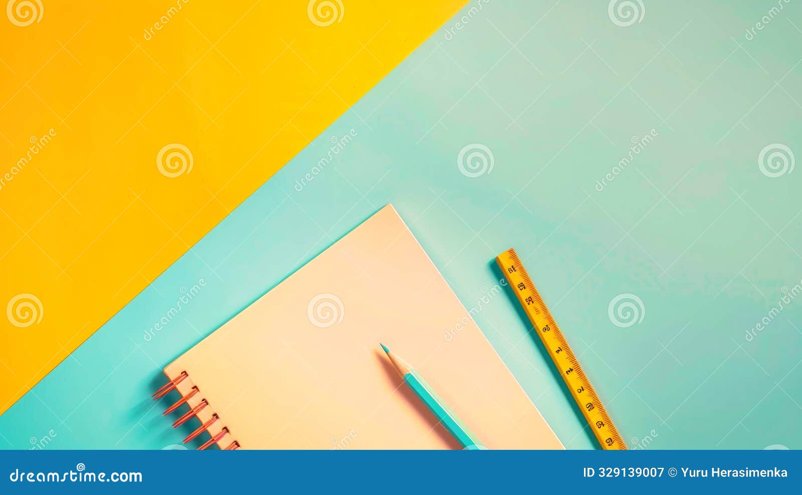 A Notepad, Pencil, and Ruler Sit on a Pastel Blue and Yellow Surface ...