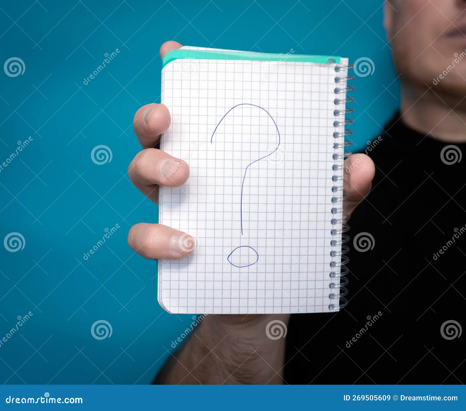 Notepad with a Question Mark in the Hand of a Young Man Studio Shot on ...