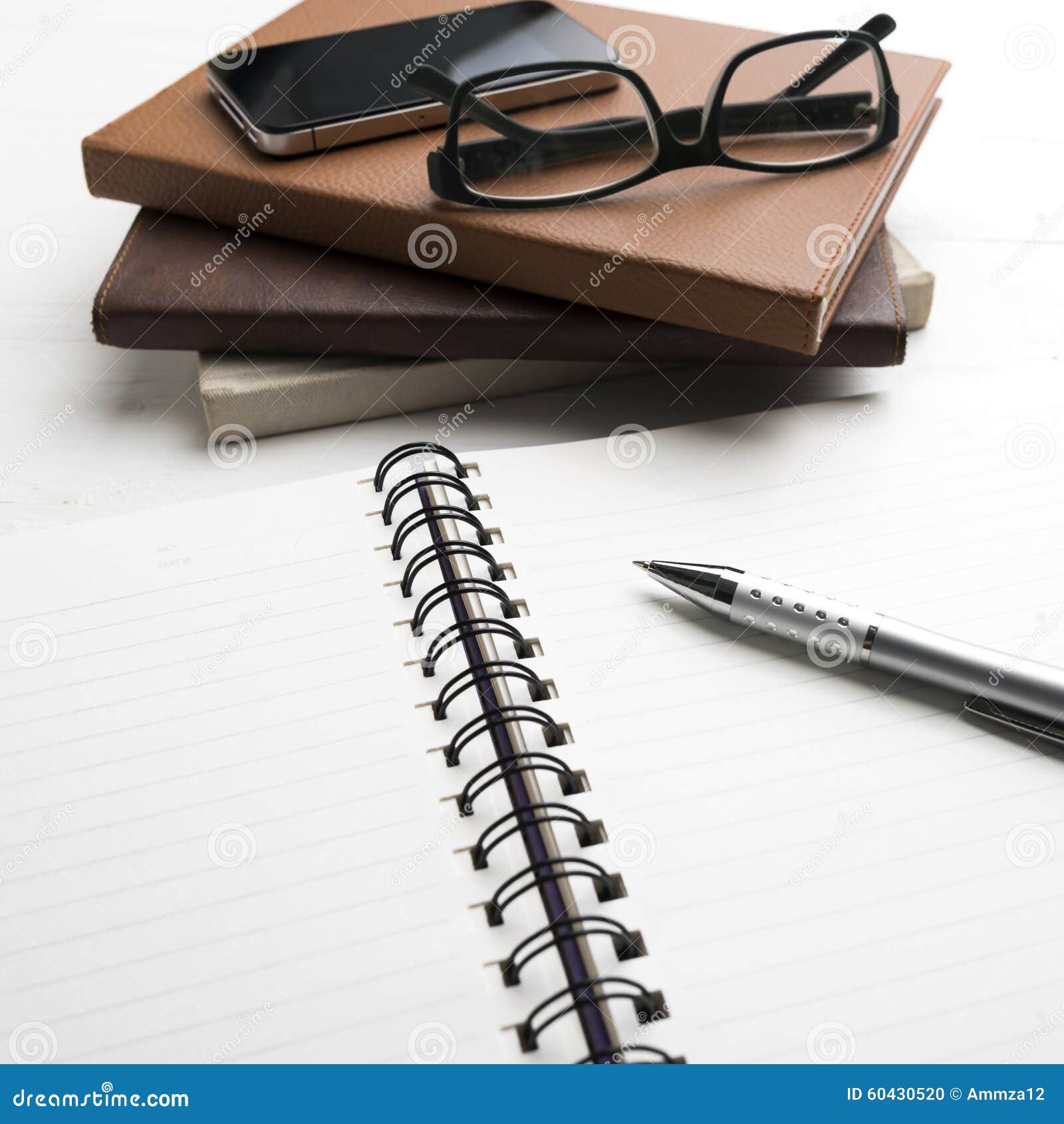 Notepad with stack of book stock photo. Image of book - 60430520