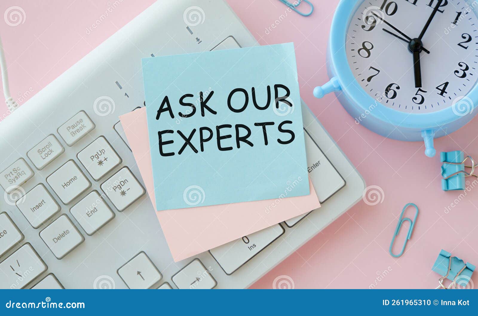 Notepad With Text Ask Our Experts With A Pen,office Tools And Graphs On Desktop. Stock Photo ...