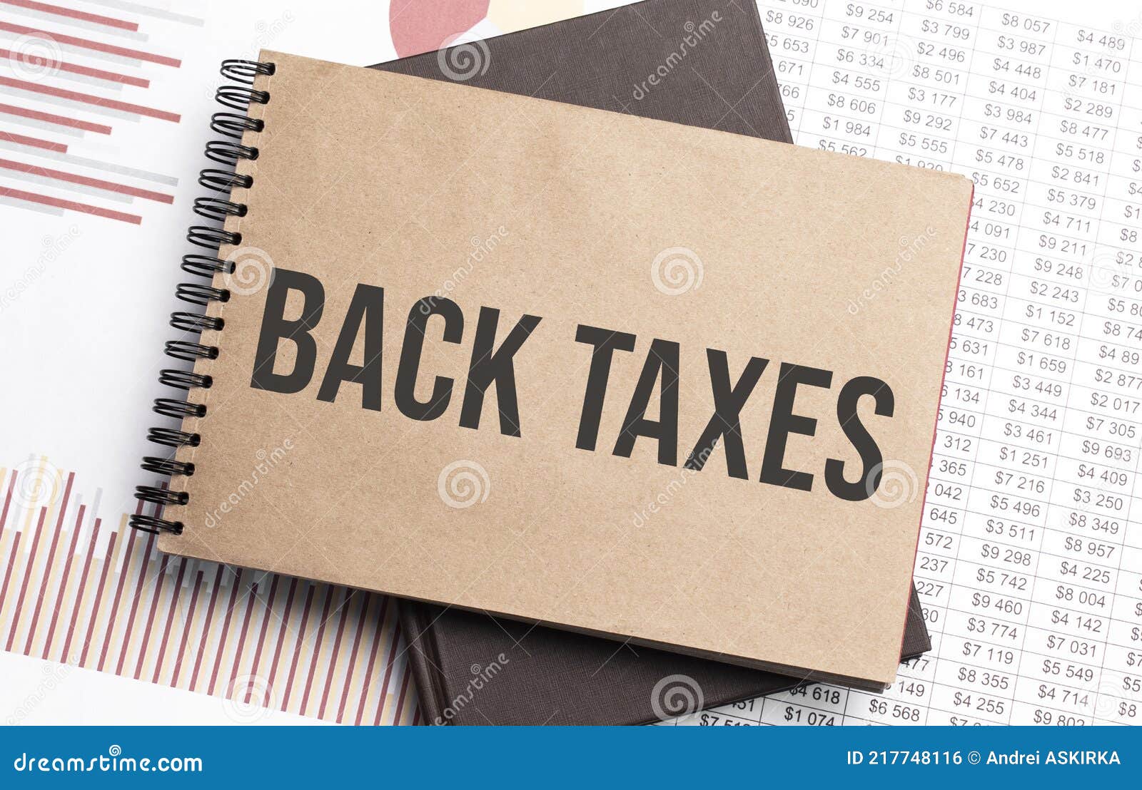 Notepad with Text BACK TAXES on a Charts and Numbers. Business Concept ...