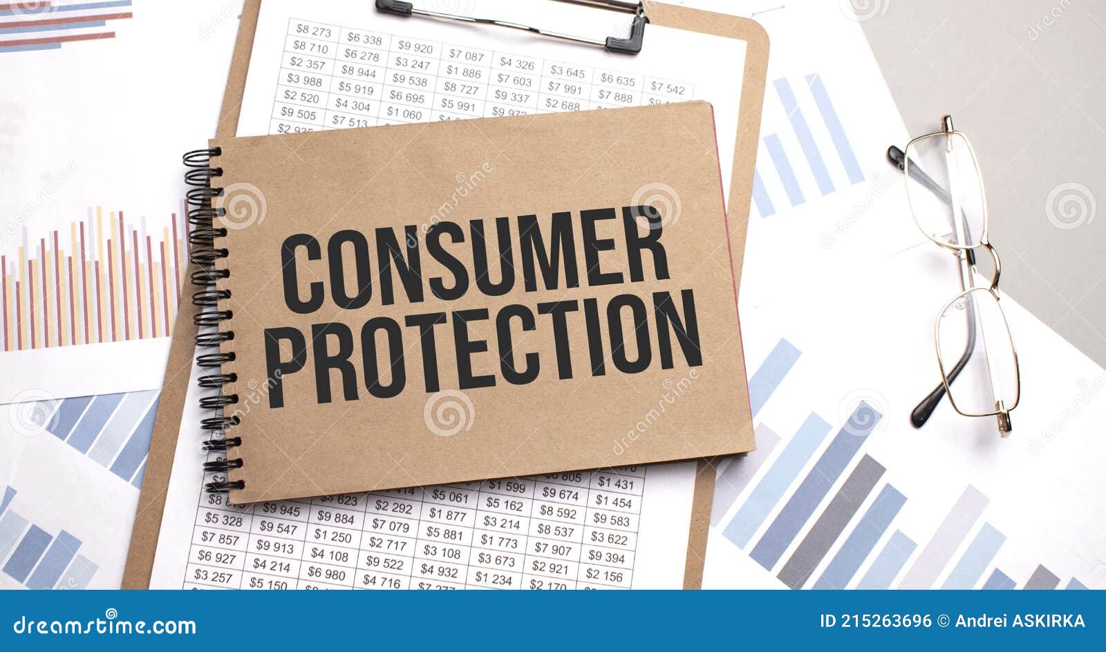 Notepad with Text CONSUMER PROTECTION on a Charts and Numbers. Business ...