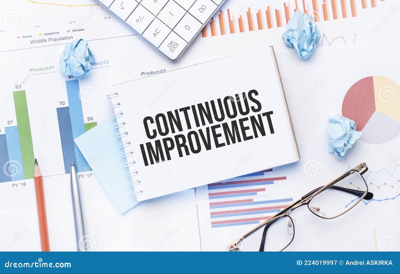 Notepad with Text Continuous Improvement on the Business Charts and Pen ...