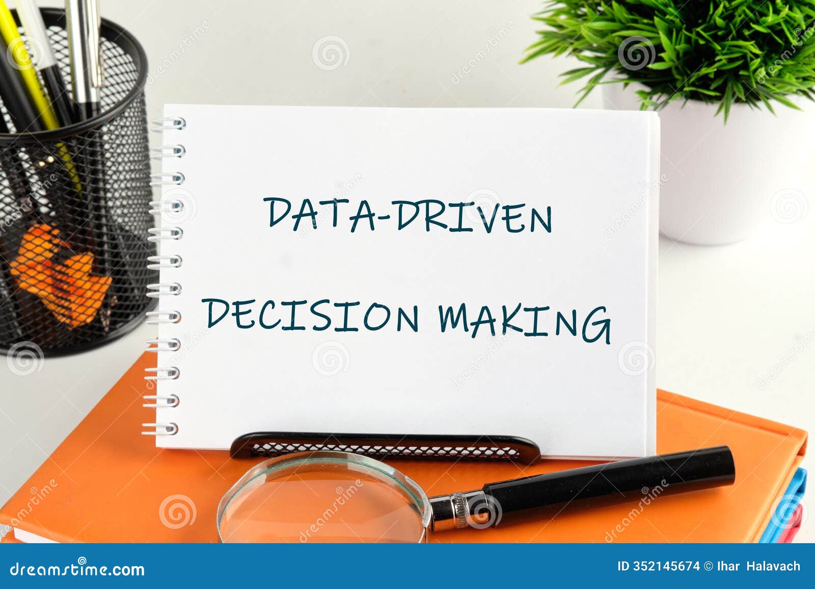 Notepad Displays Data-driven Decision Making On A Desk With A ...