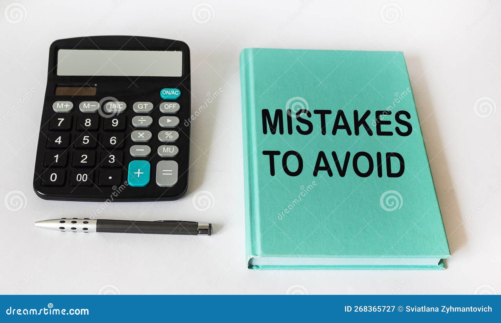 Notepad with Text Errors To Avoid with a Calculator on a White ...