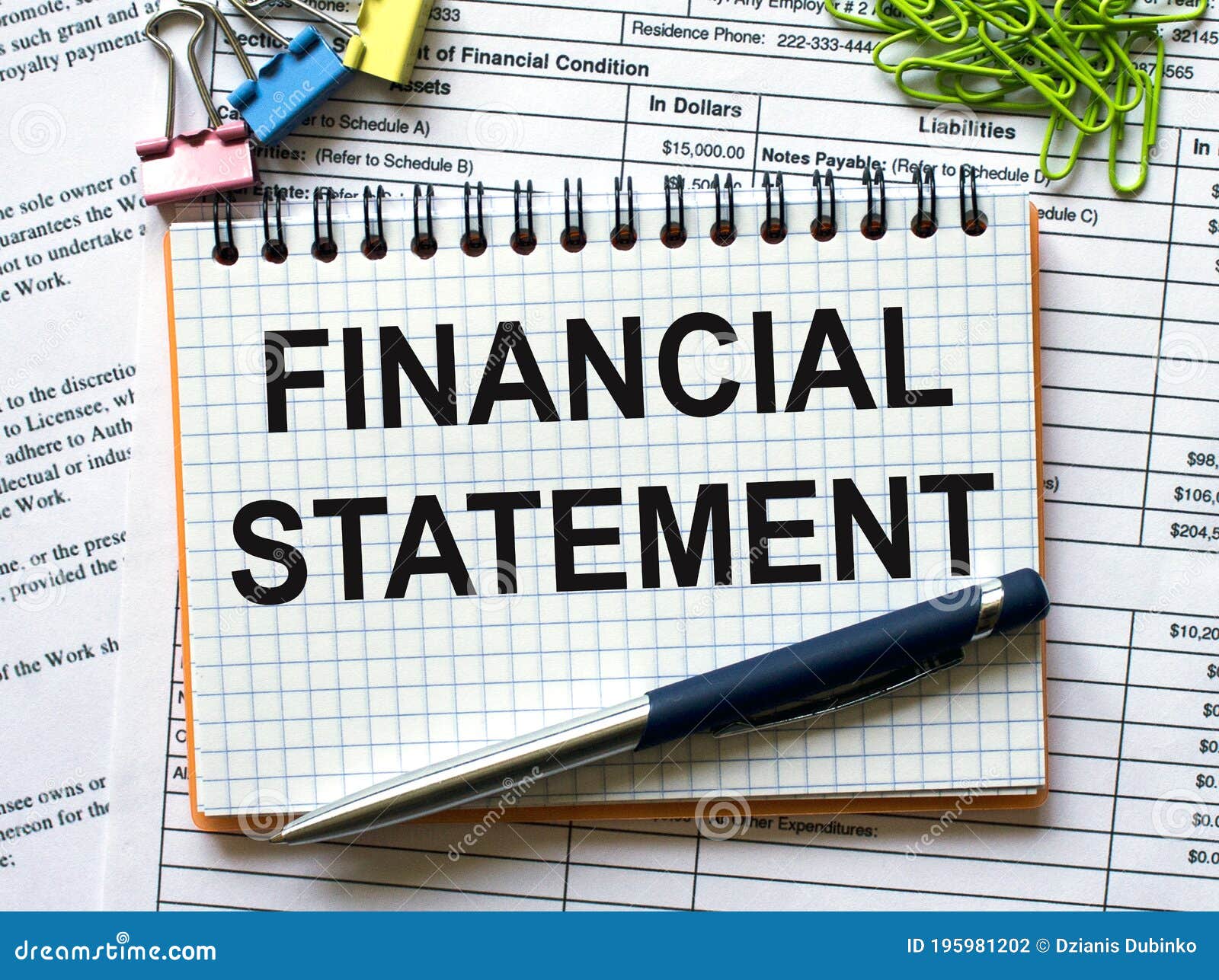 Notepad with Text Financial Statement on White Background with Paper ...