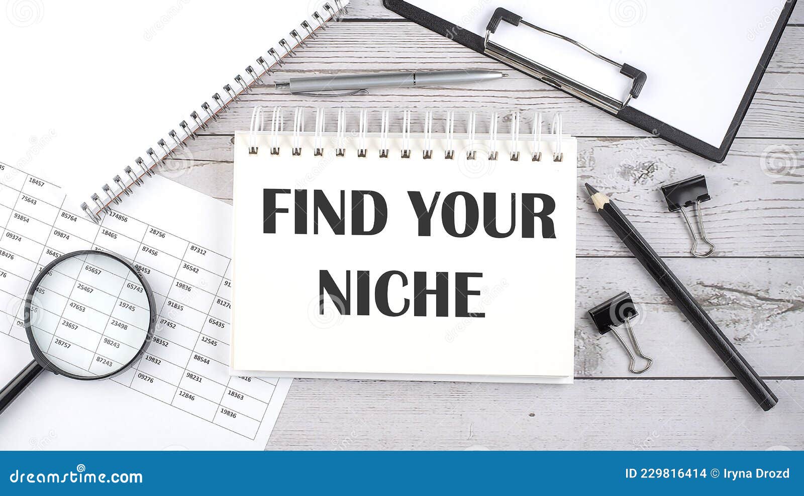 Notepad with Text FIND YOUR NICHE with a Pen,office Tools and Graphs on ...