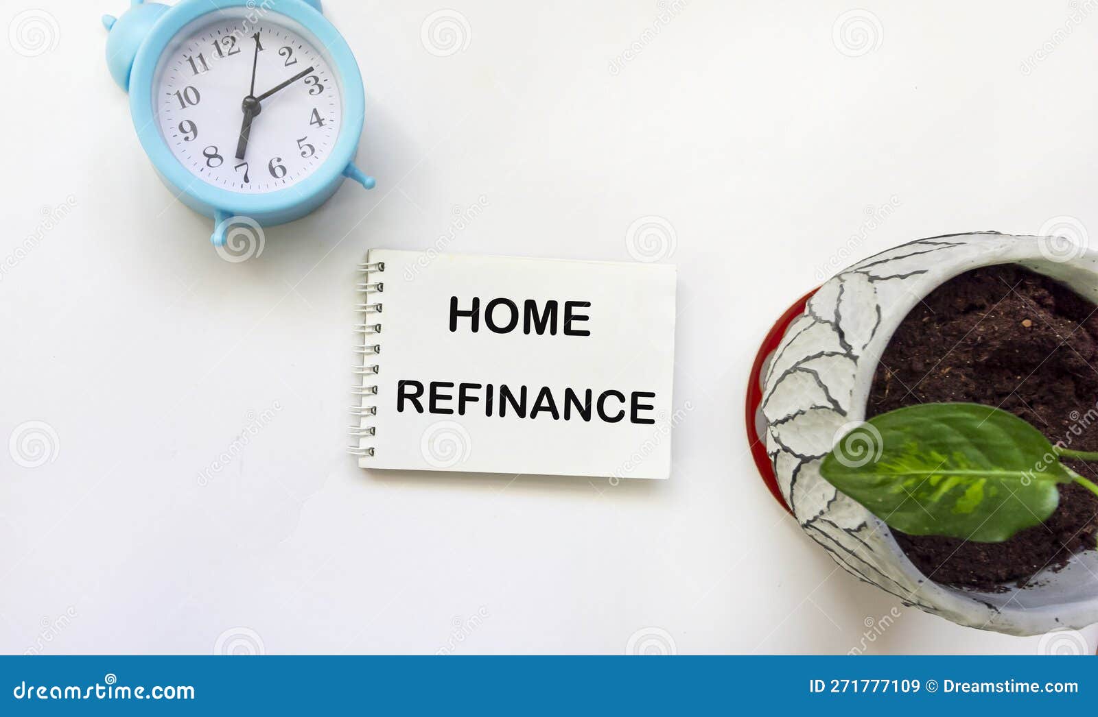 Notepad with Text HOME REFINANCE with Clock and Flower on White ...