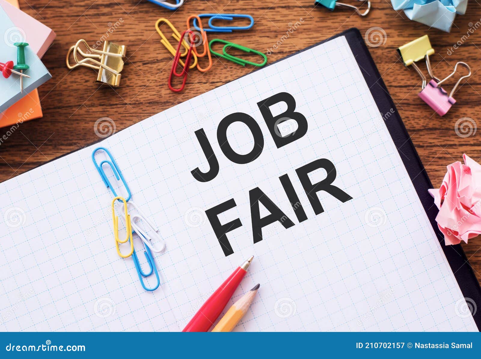 Notepad with the Text JOB FAIR on the Table with Colored Paper Clips ...