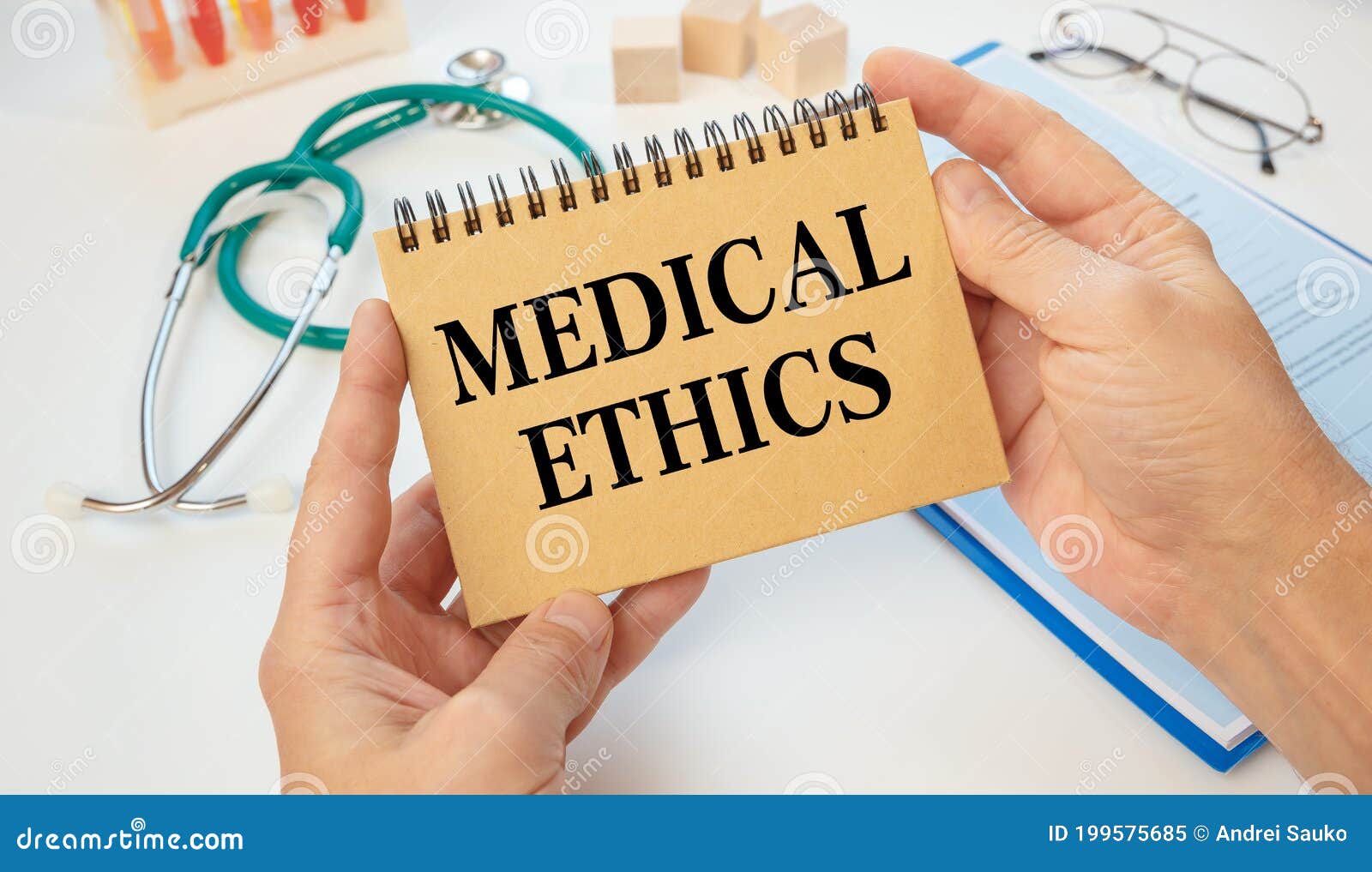 Notepad with Text MEDICAL ETHICS in the Hands of a Doctor Stock Image ...