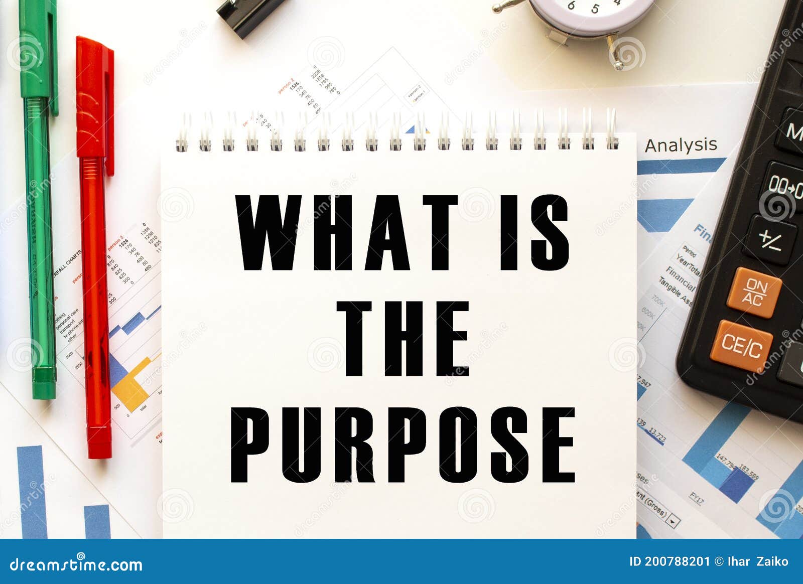 Notepad with the Text WHAT is the PURPOSE on a Color Financial Chart ...