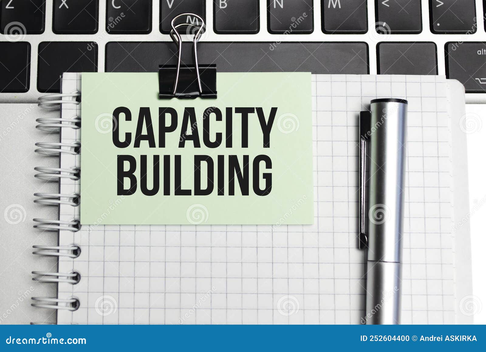 Notepad with the Text Word Capacity Building on Laptop Stock Photo ...