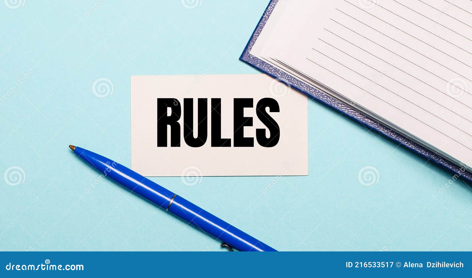Notepad, White Pen and Card with the Inscription RULES on a Blue ...