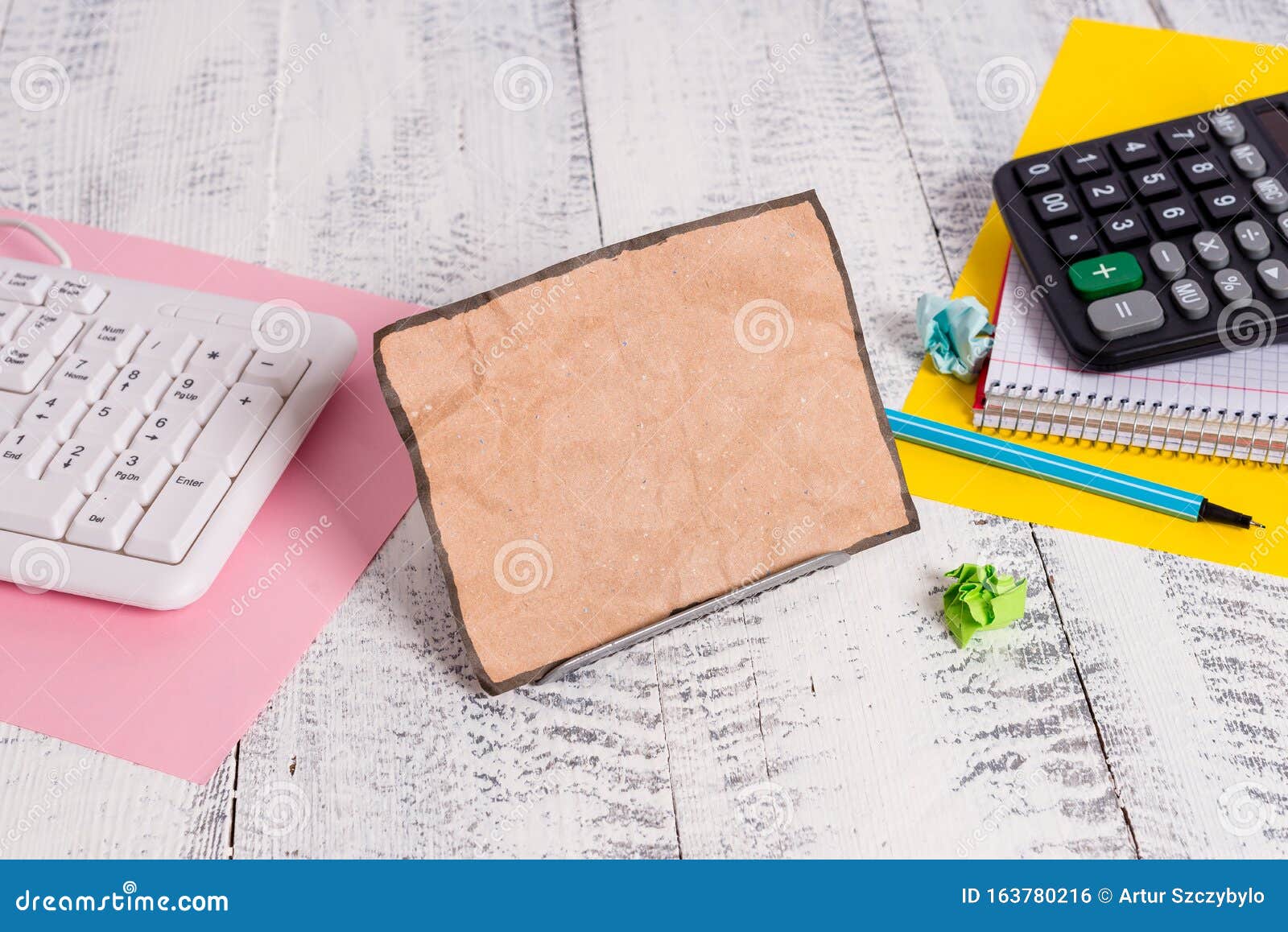 Notepaper in Brown Colour Standing on a Buffer Wire in between a ...