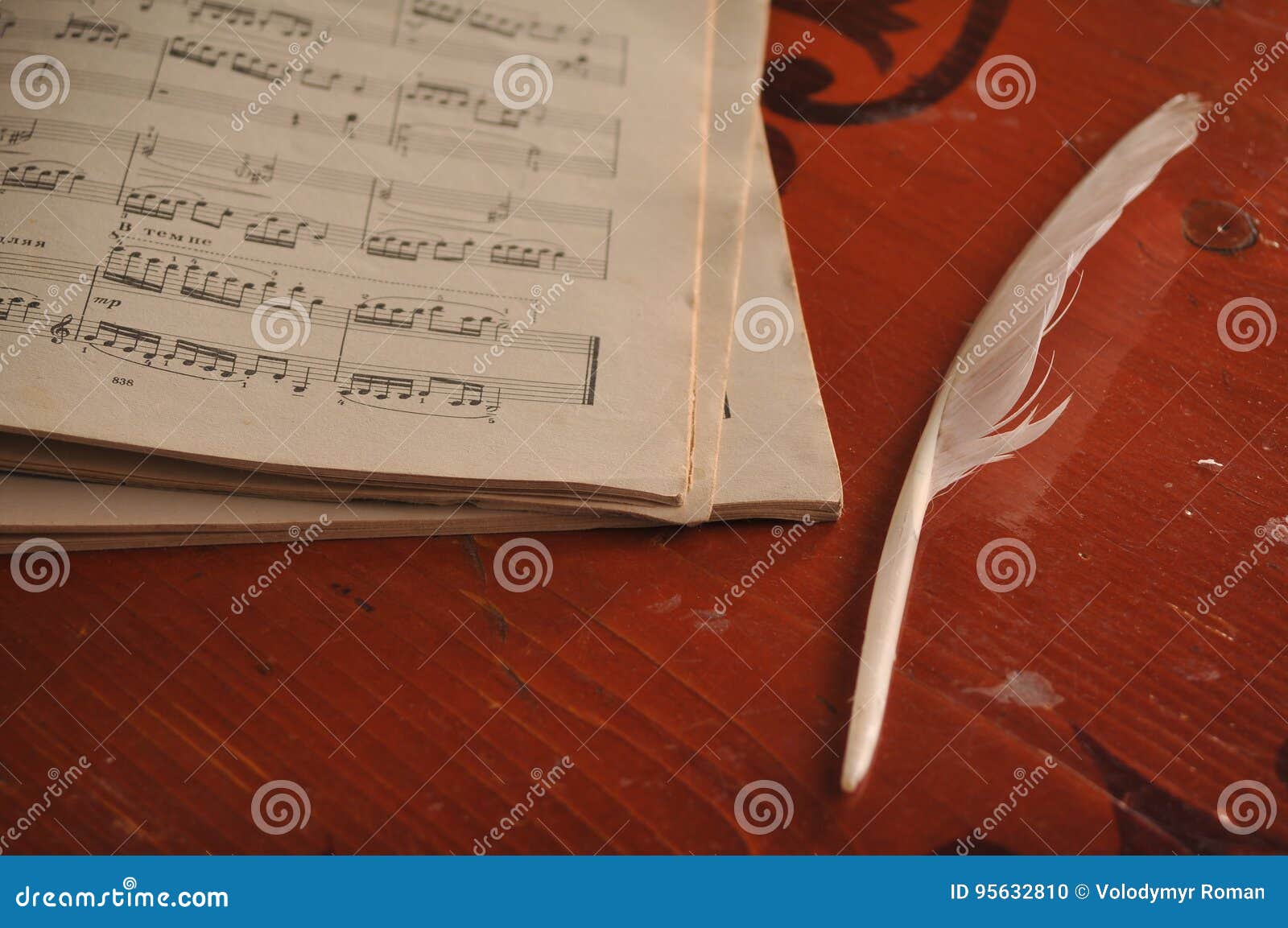 Notes and Feather on the Table Stock Photo - Image of instrument, table ...