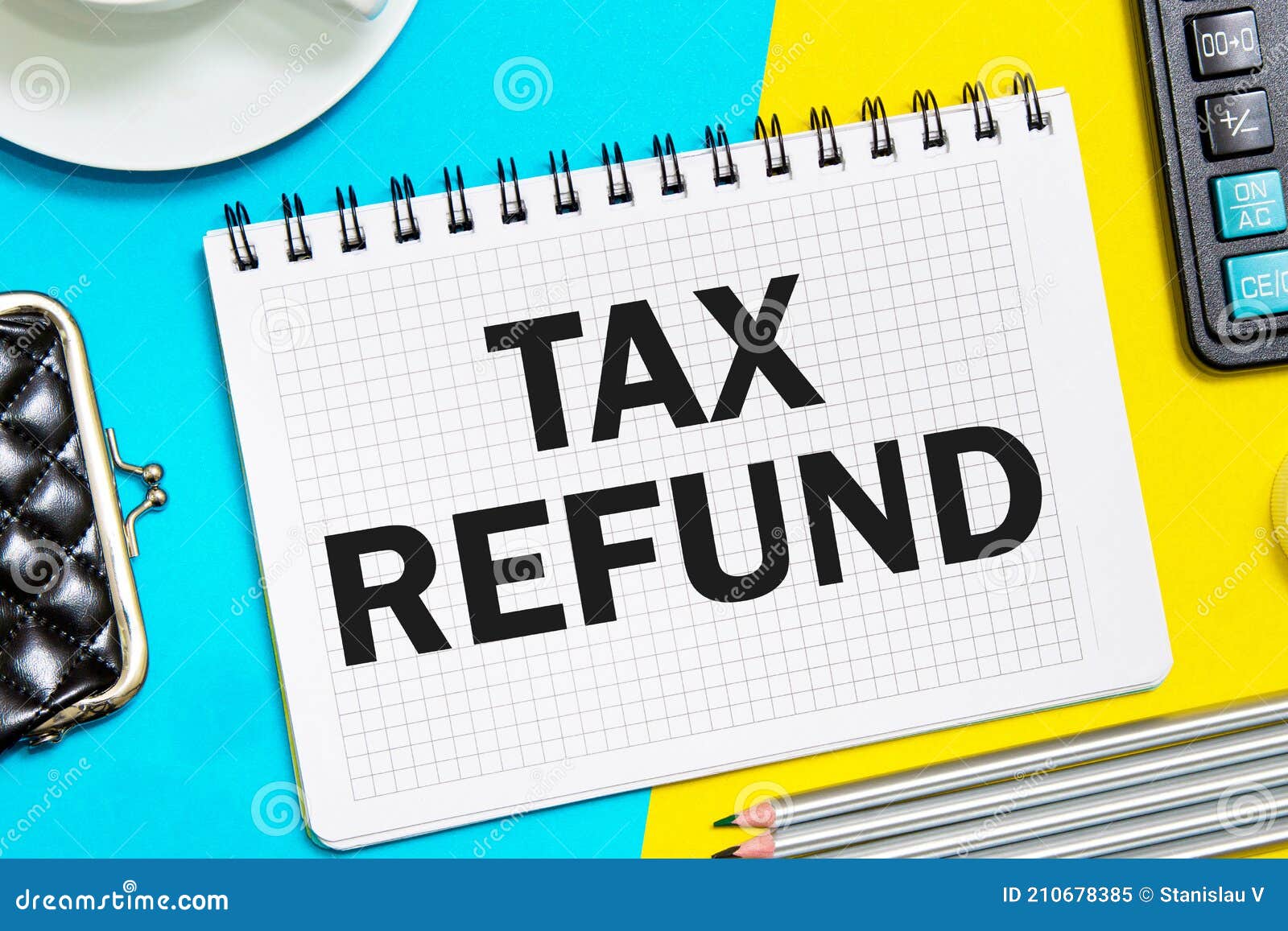Notes Notebook with a TAX REFUND with the Office Tools on Yellow Blue ...