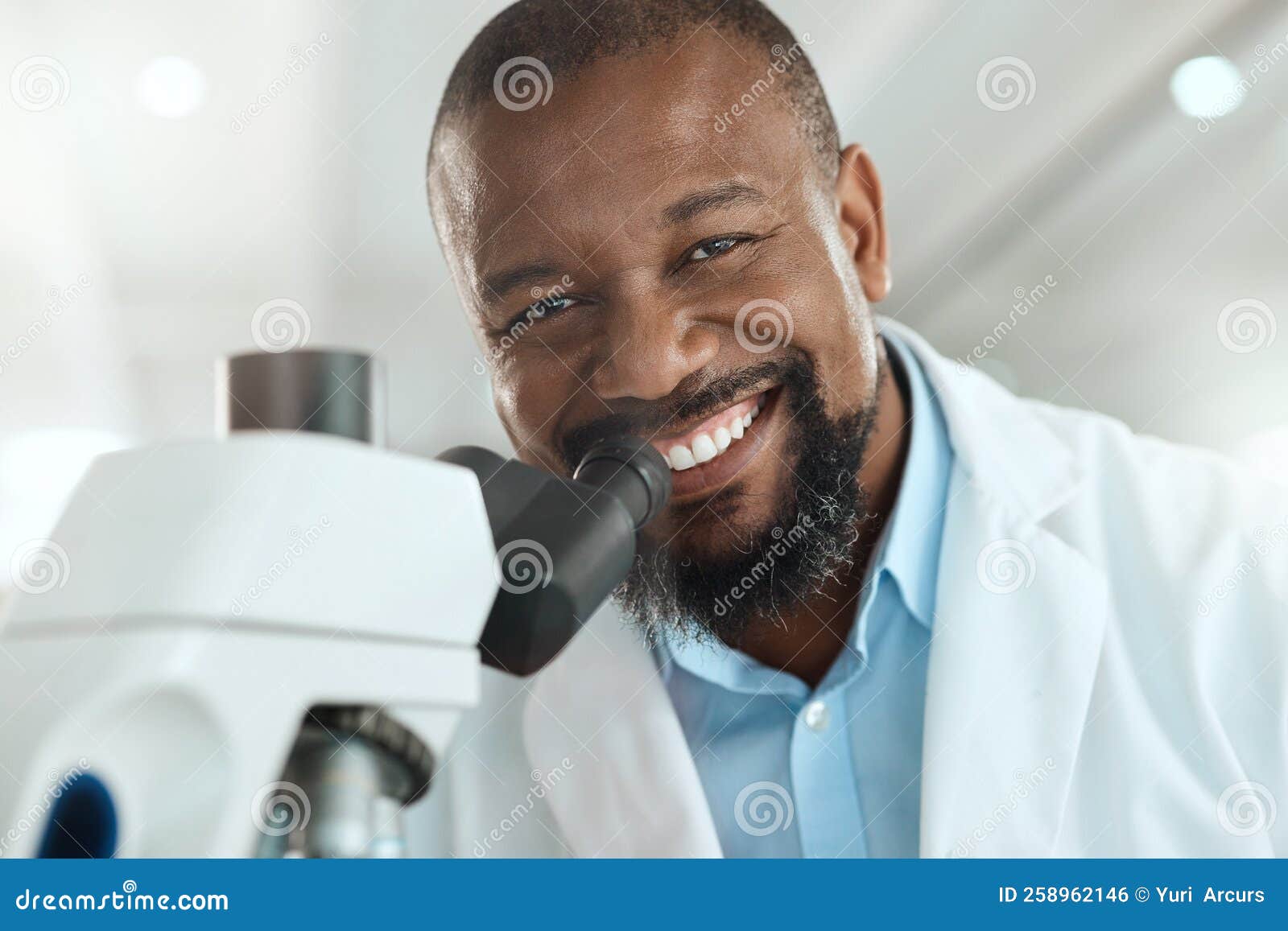 Nothing Gets Passed Me. a Handsome Mature Scientist Using a Microscope ...