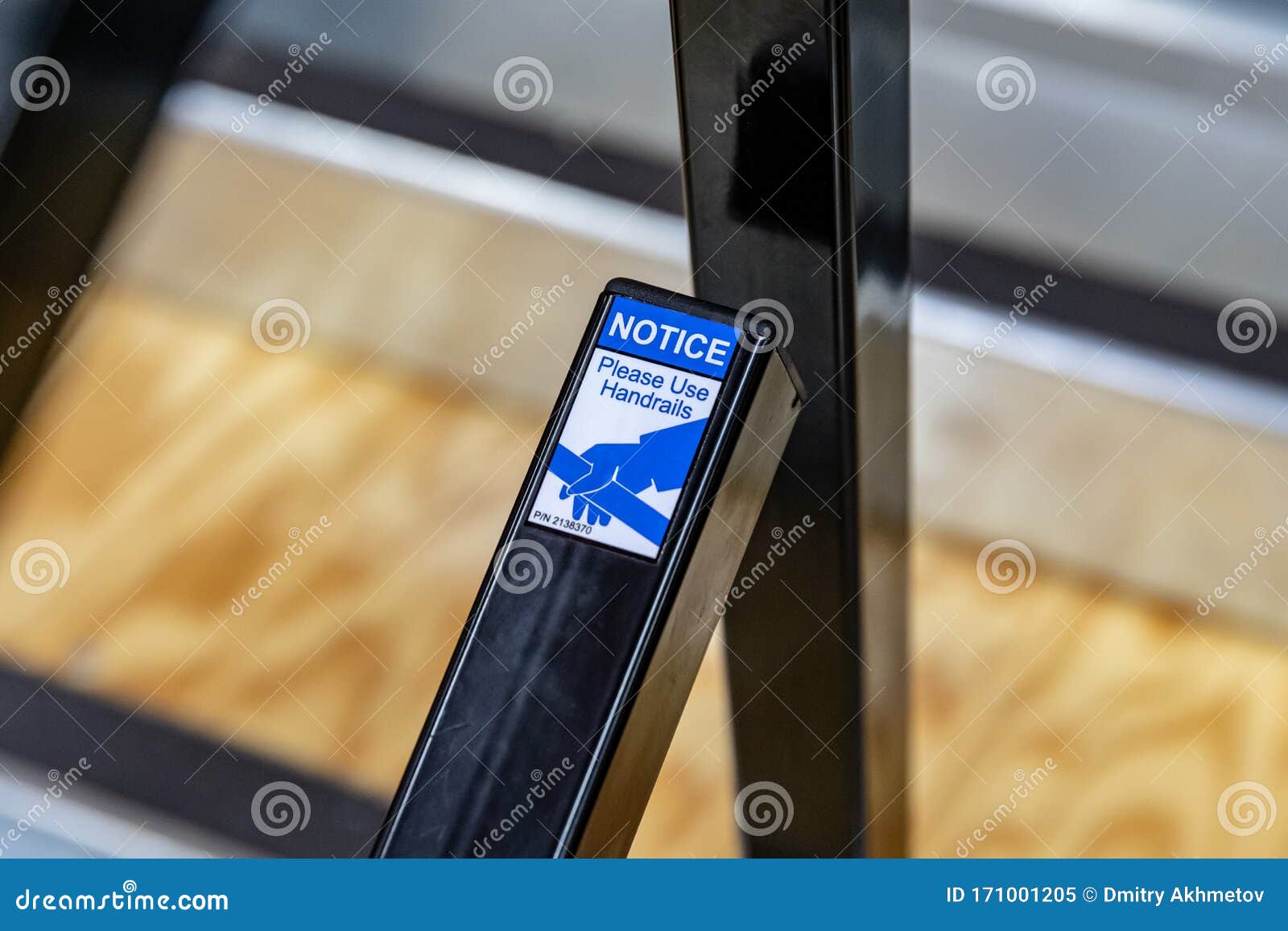 A Notice Sticker `Please Use Handrails` on a Black Handrails Stock ...
