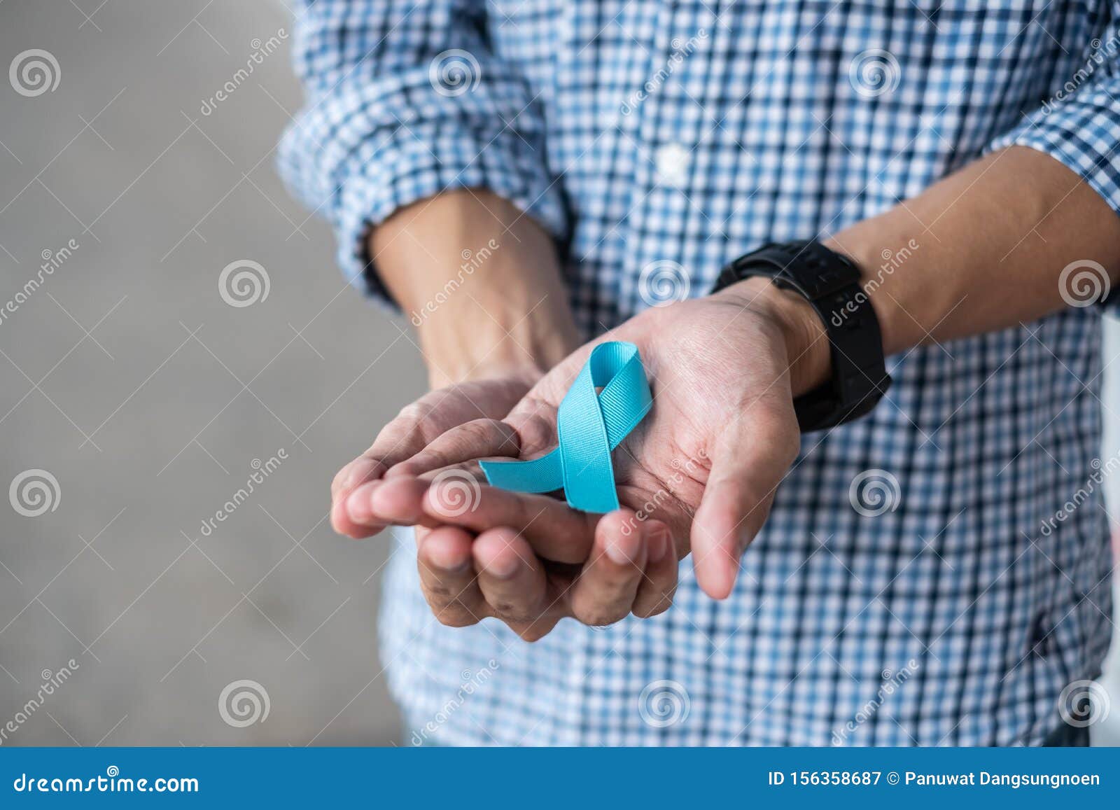 November Prostate Cancer Awareness Month Man In Blue Shirt With Hand